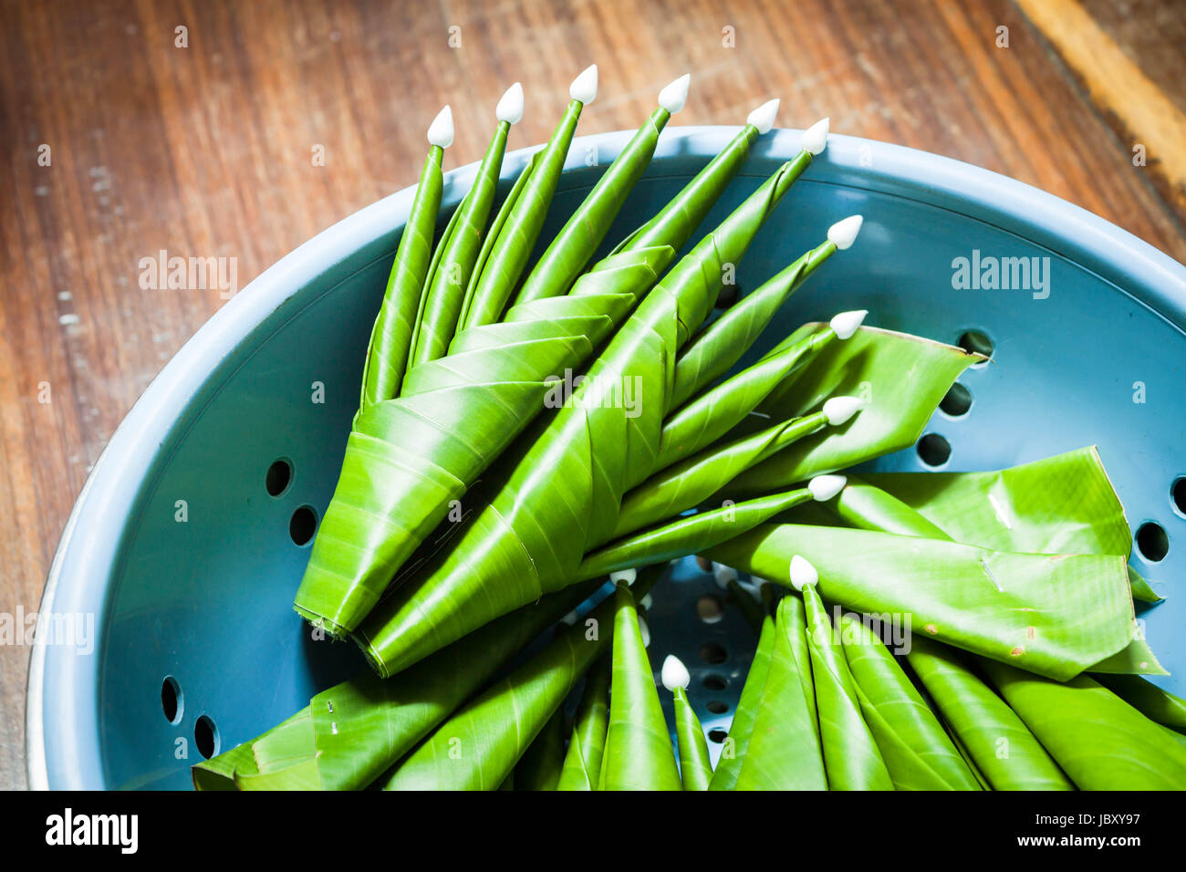 Handmade banana leaf rice offering in basket Stock Photo - Alamy