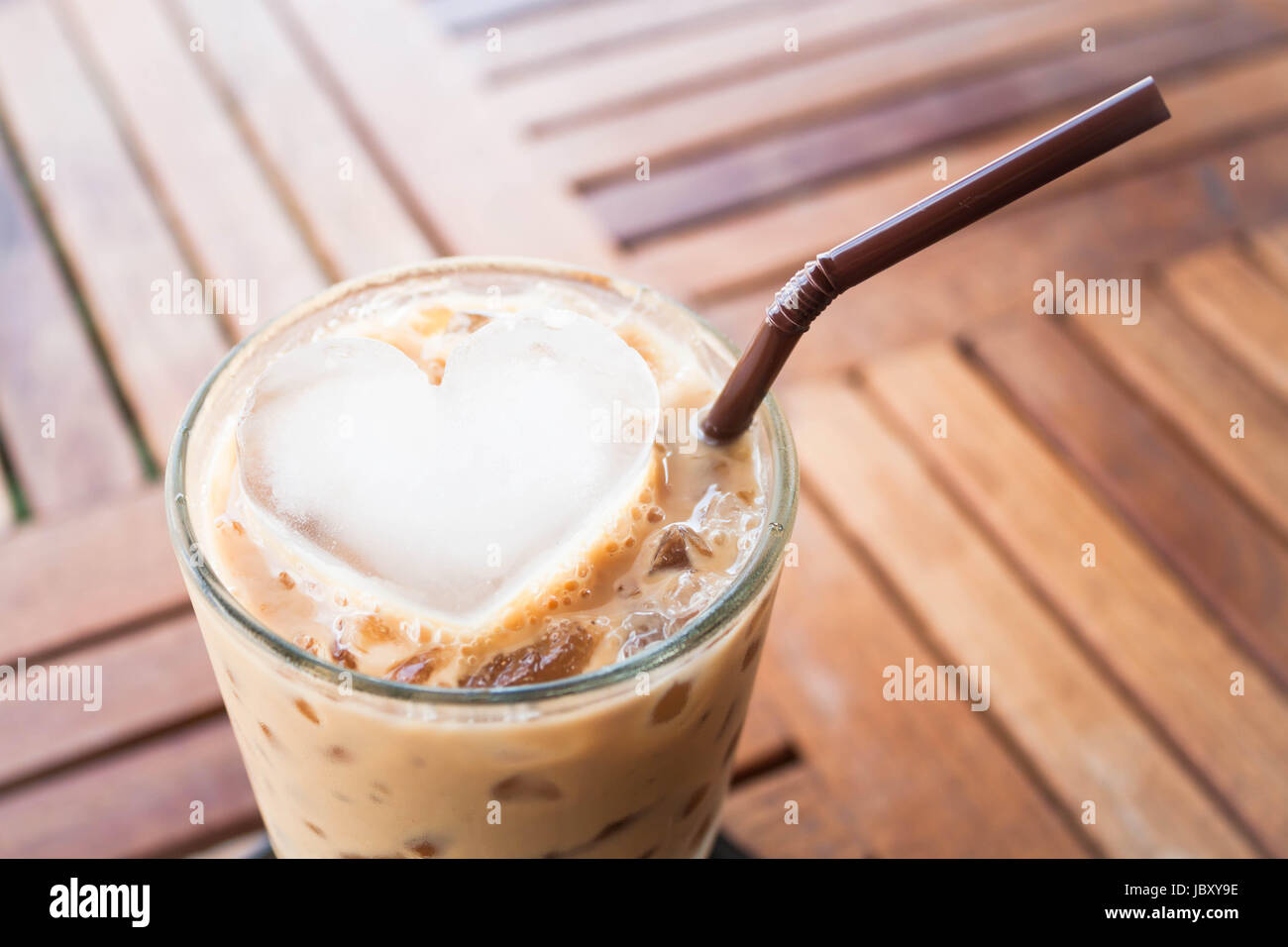 Cold coffee drink with heart ice cube Stock Photo - Alamy