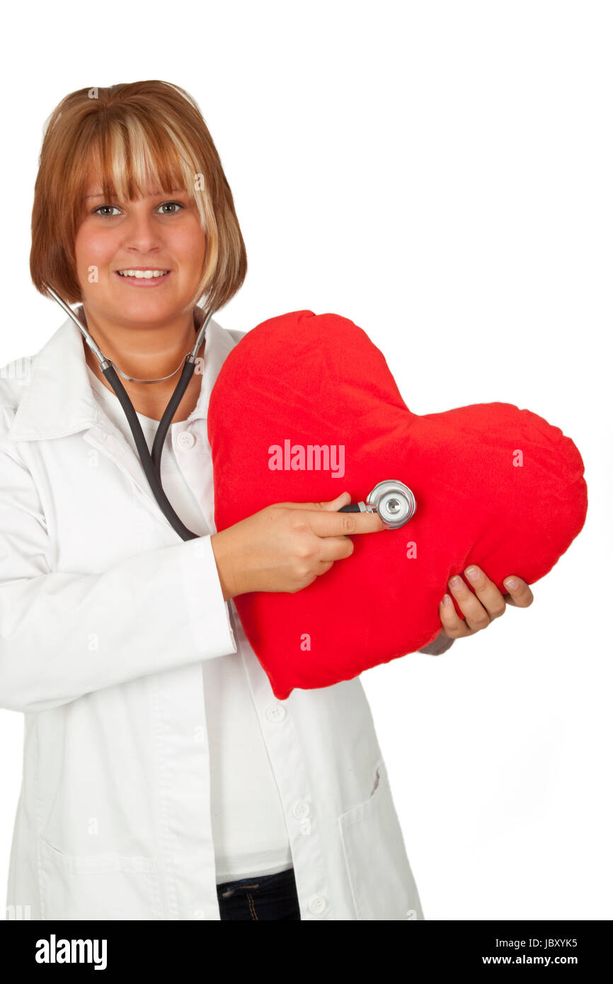 Heart in hand, doctor with stethoscope isolated on whitebackground ...