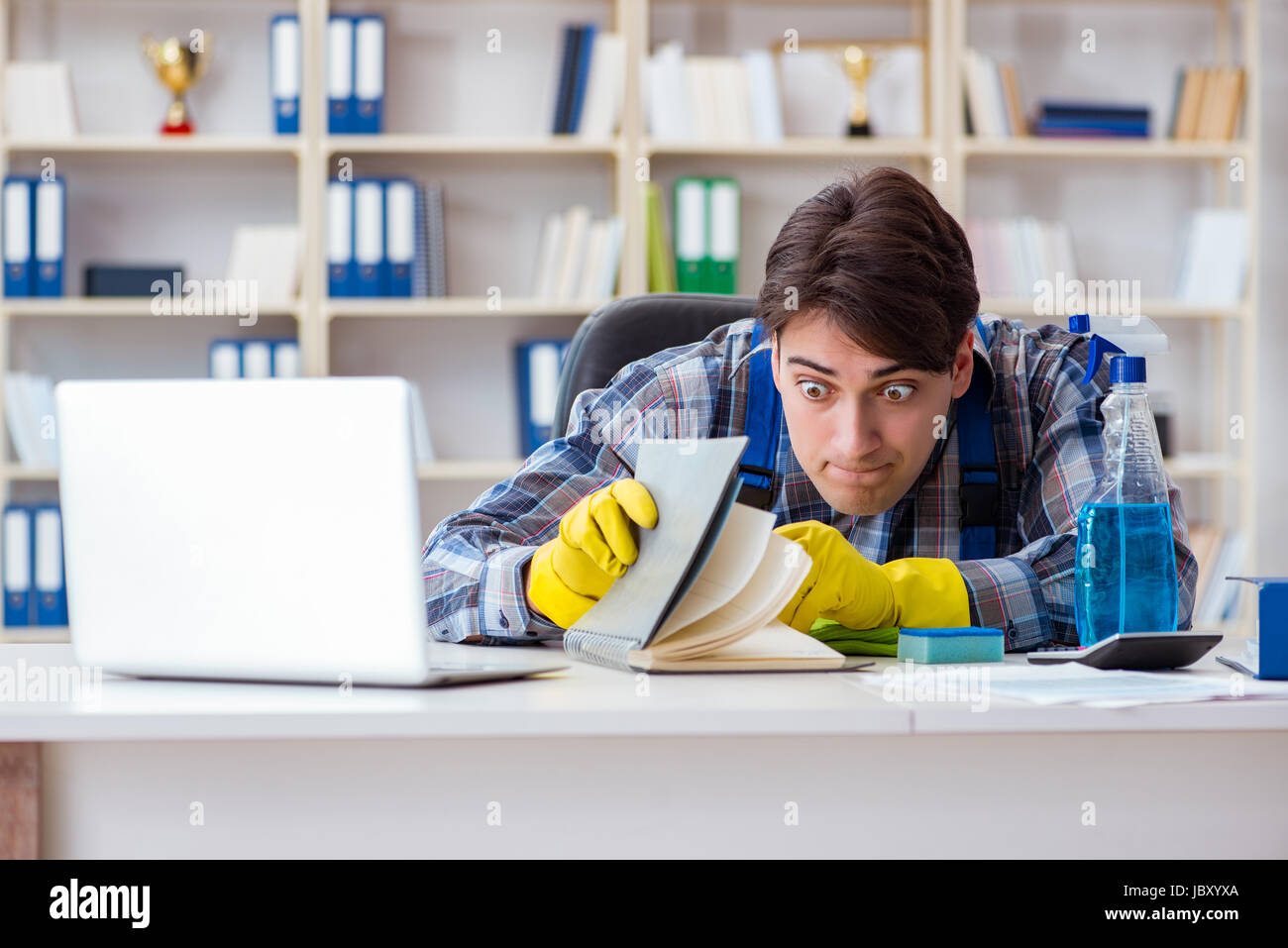 Man cleaner stealing confidential documents Stock Photo - Alamy