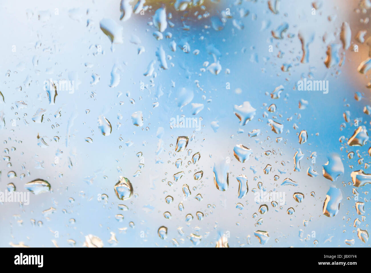 Veritable rain drops behind the window mirror Stock Photo - Alamy