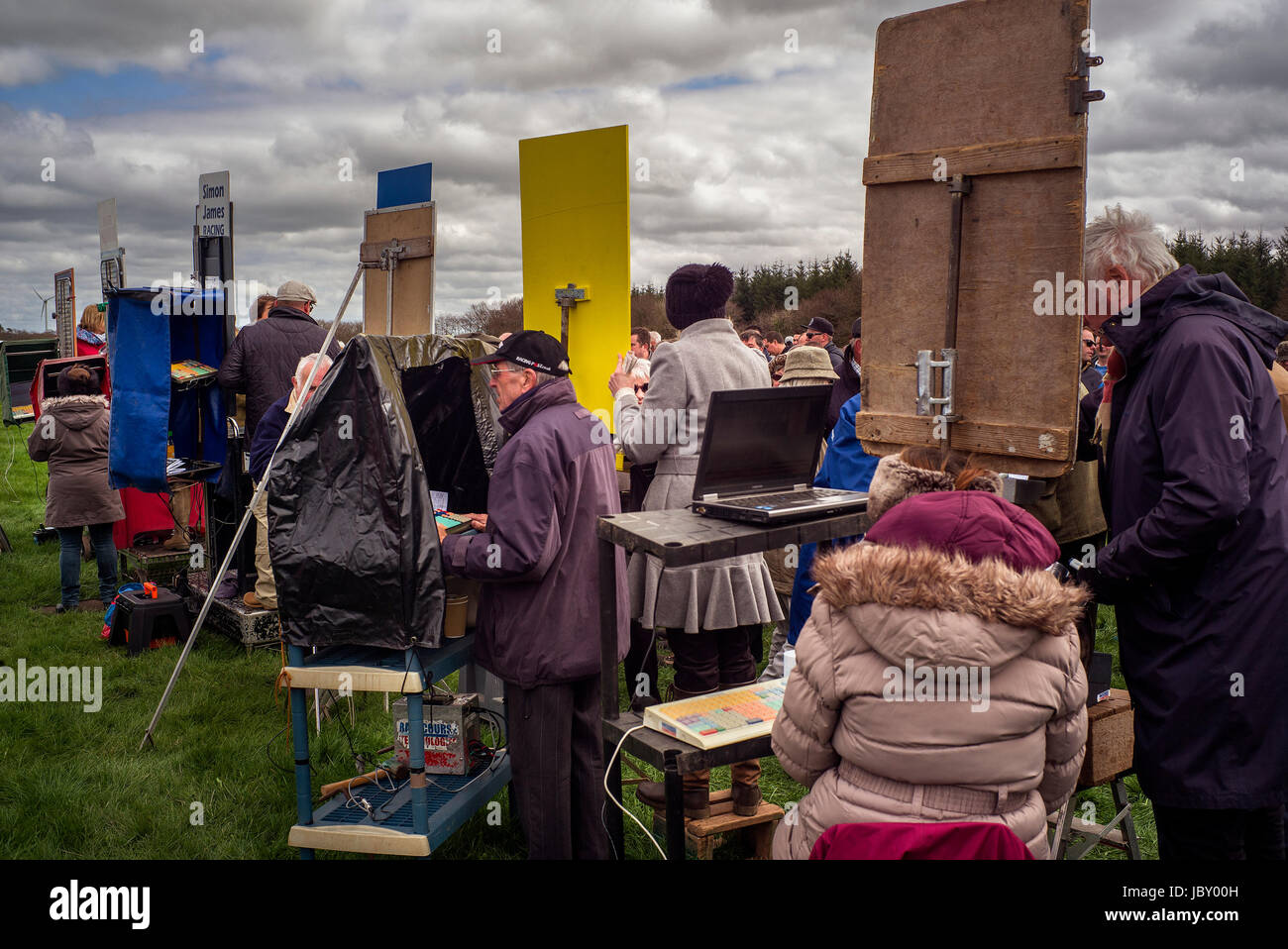 dark sky,over croud and race track totes,race totes taking bets at ...