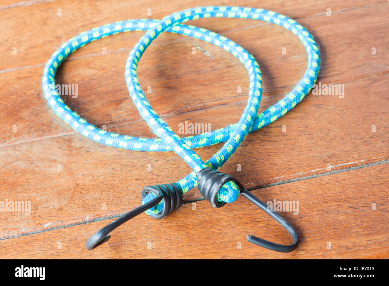 Light blue rubber band with metal hooks Stock Photo - Alamy