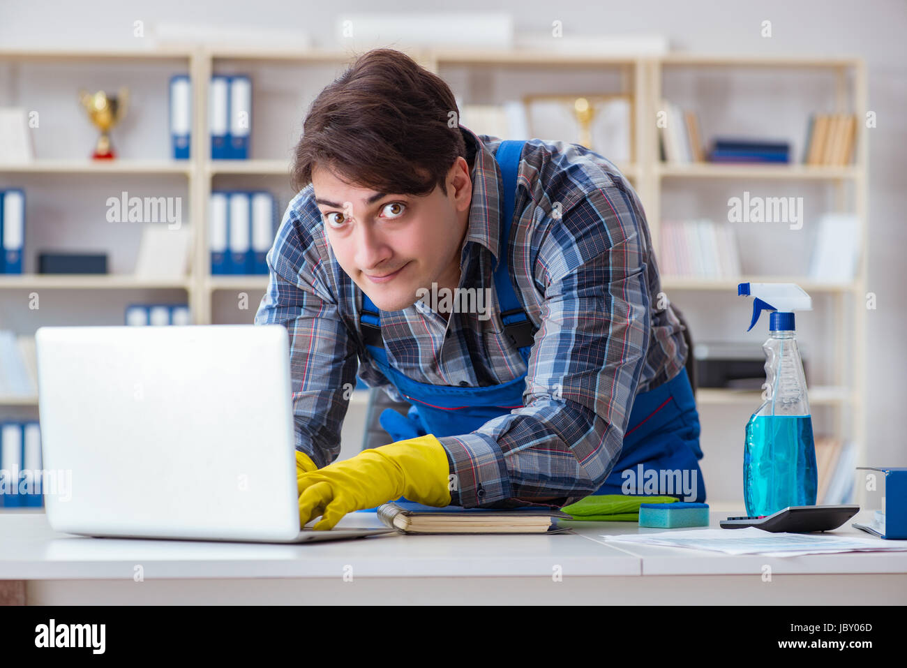 Hacker under cleaner cover stealing personal data Stock Photo - Alamy