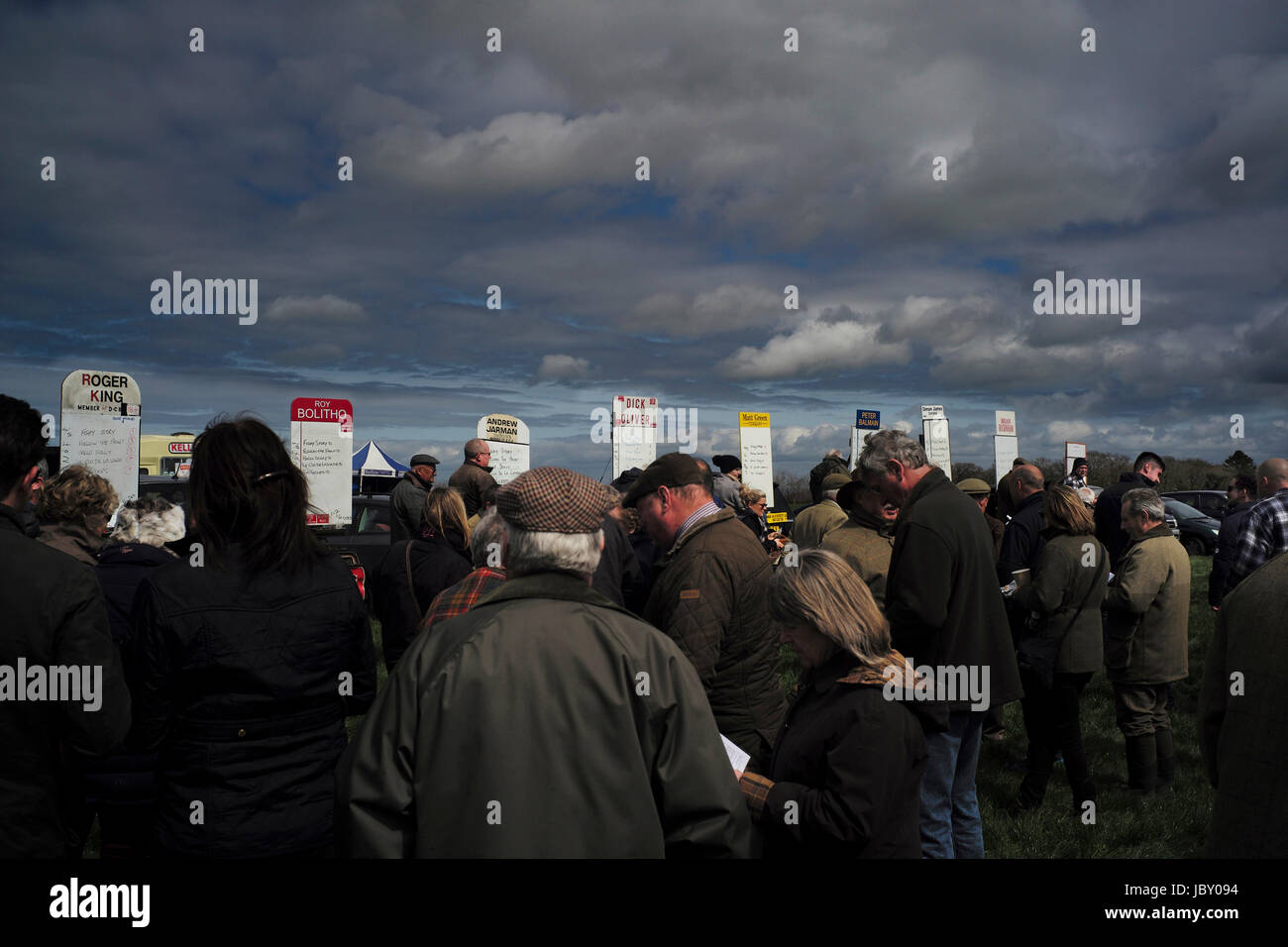 dark sky,over croud and race track totes,race totes taking bets at ...