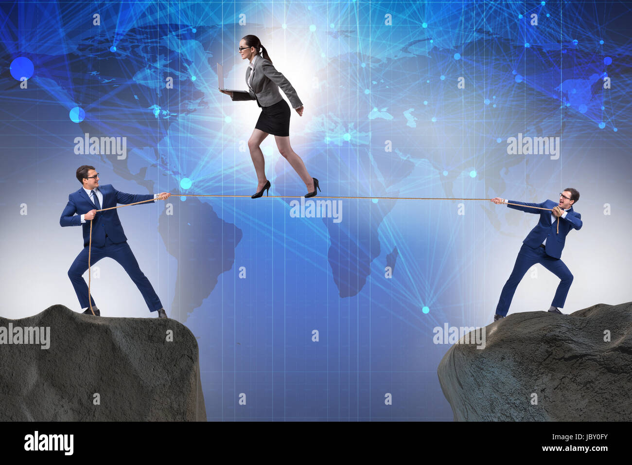 Business concept with tight rope walker Stock Photo - Alamy
