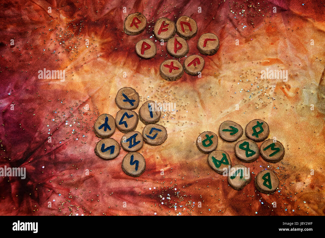 three sets of wooden fortune telling runes, an ancient alphabet known ...