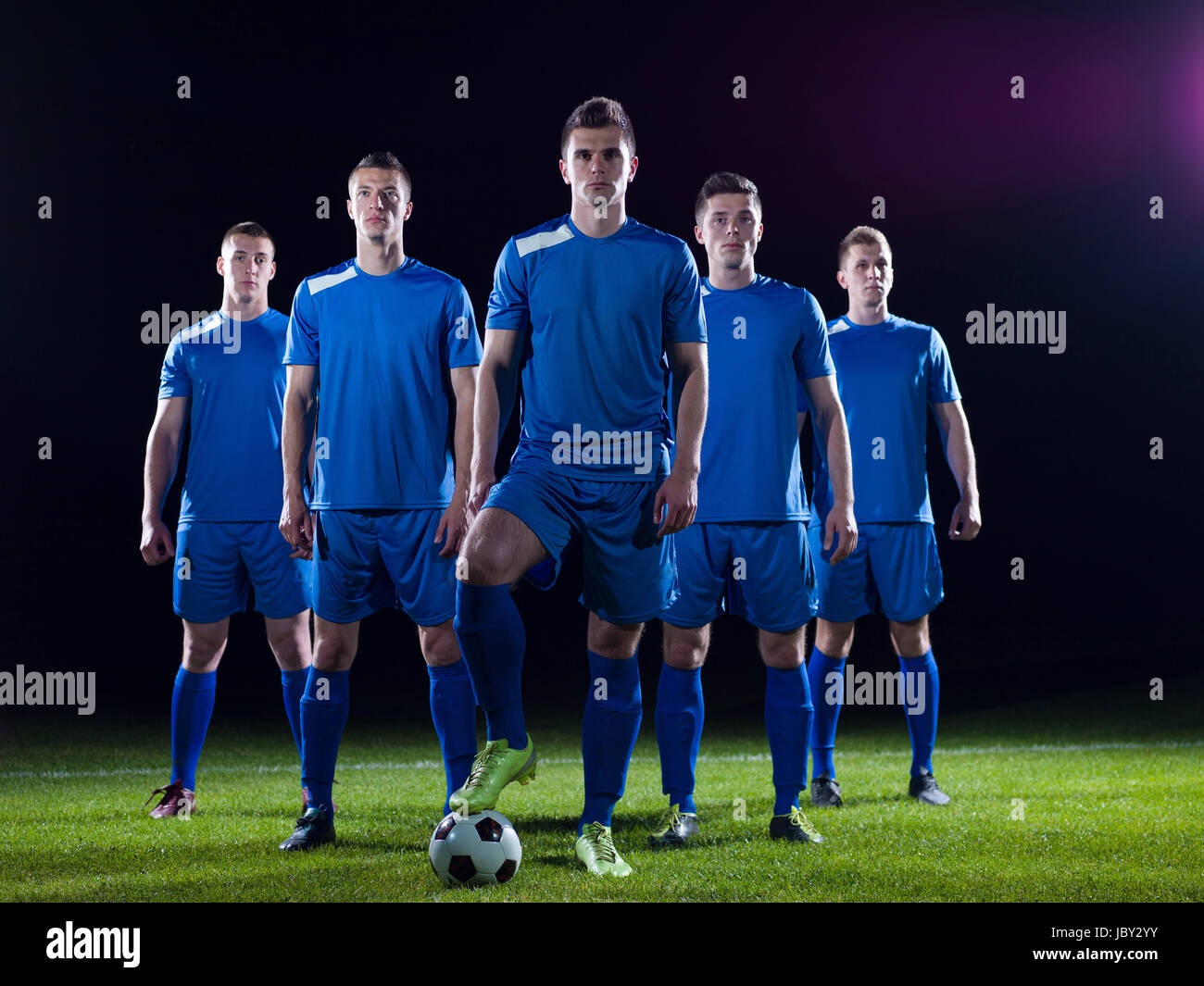 soccer players team group isolated on black background Stock Photo - Alamy