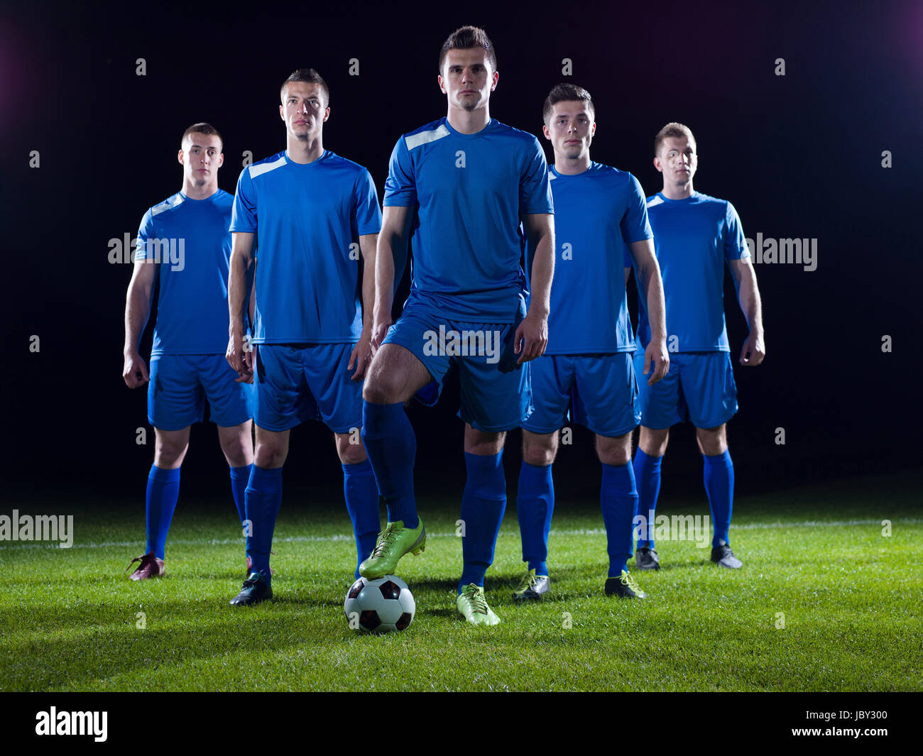 soccer players team group isolated on black background Stock Photo - Alamy