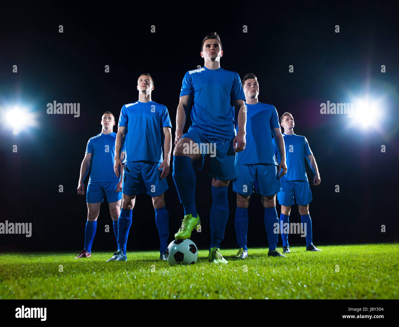 soccer players team group isolated on black background Stock Photo - Alamy