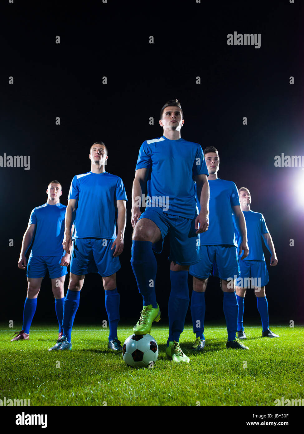 soccer players team group isolated on black background Stock Photo - Alamy