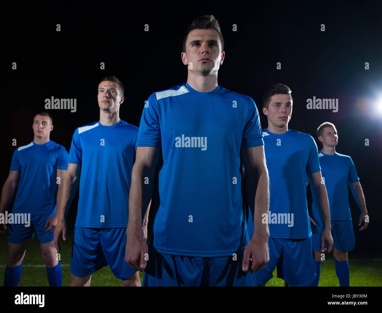 soccer players team group isolated on black background Stock Photo - Alamy
