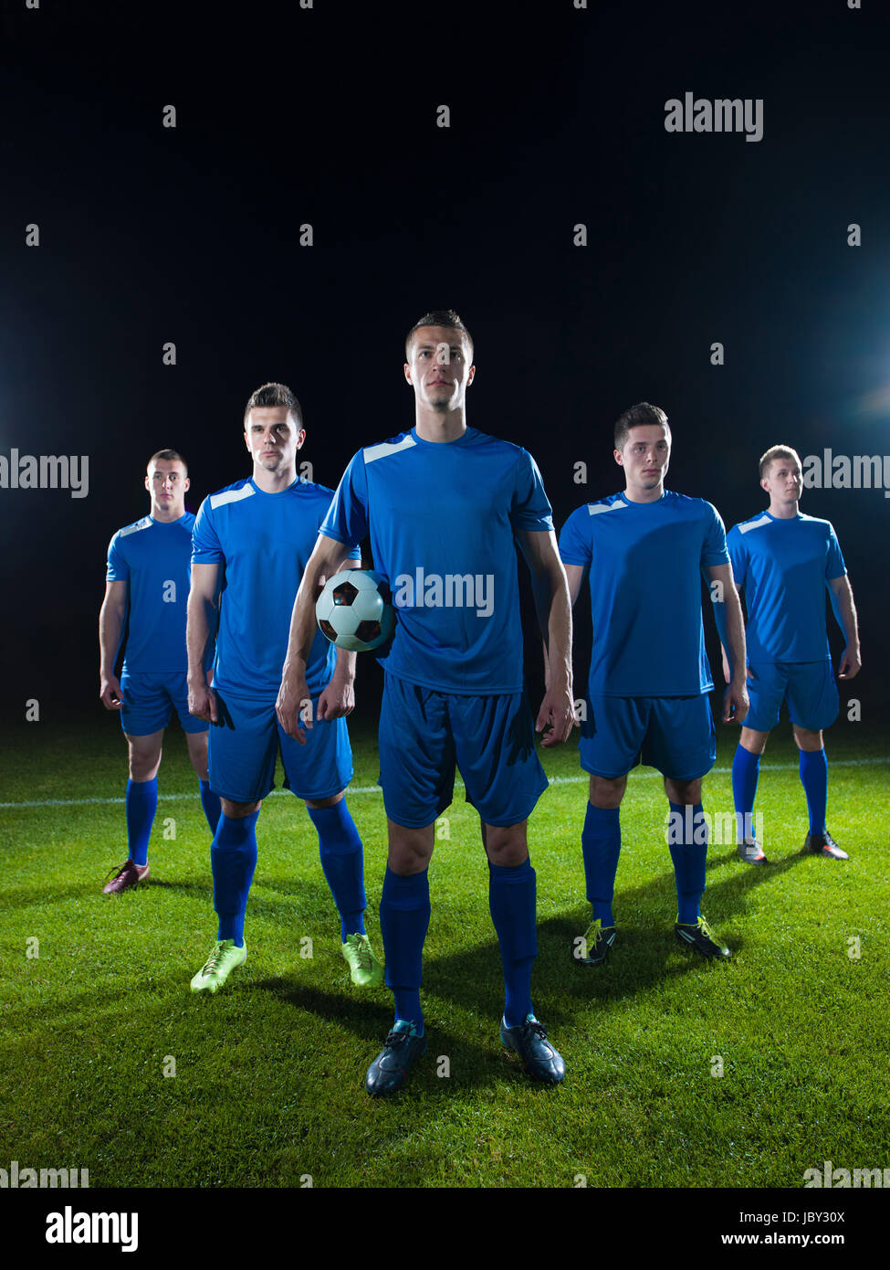 soccer players team group isolated on black background Stock Photo - Alamy