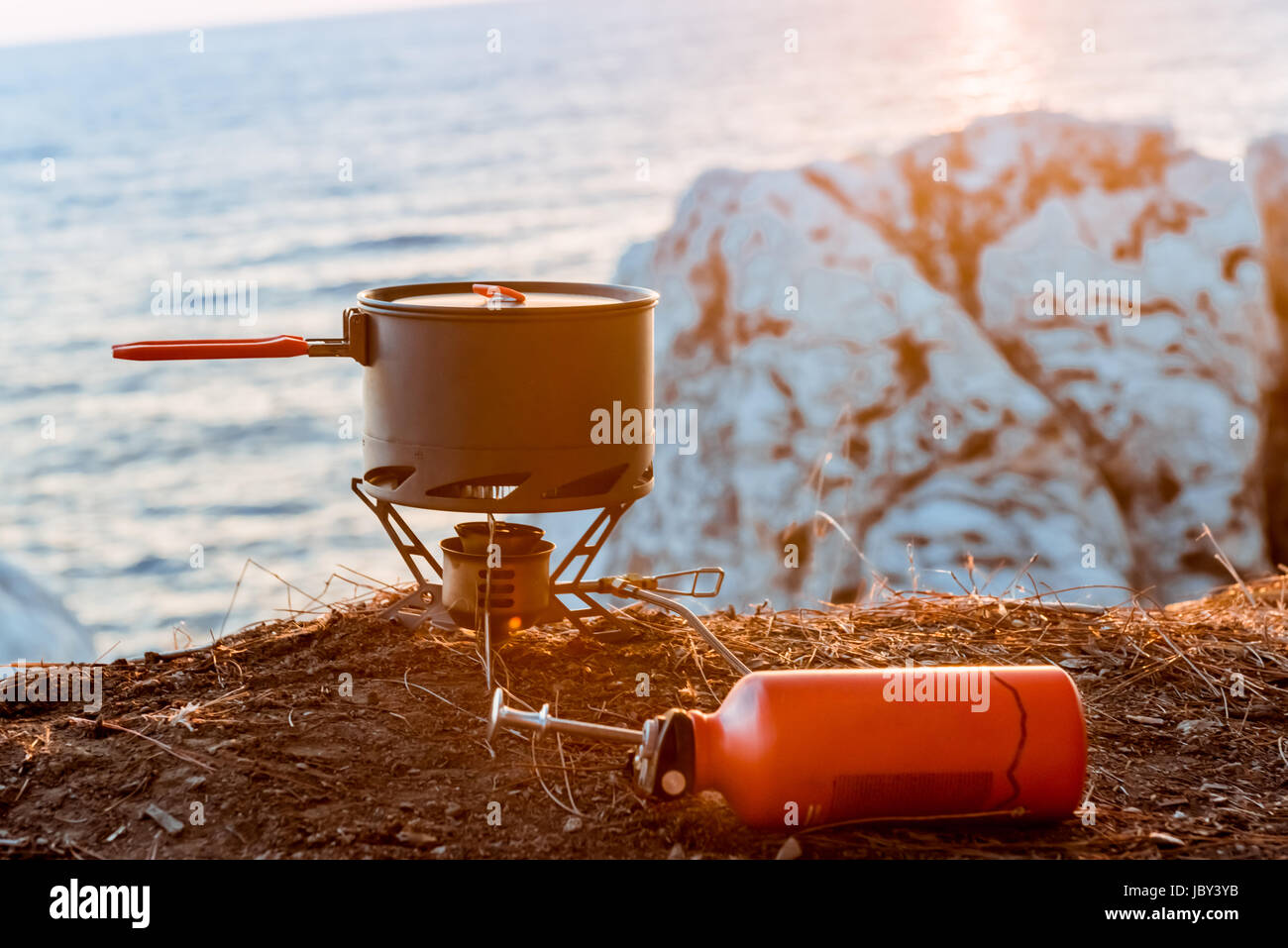 Tourist equipment and tools: camping gas over sea background Stock ...
