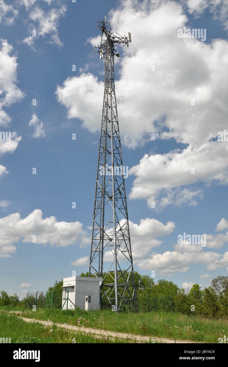Telecommunication tower on the field against the sky Stock Photo - Alamy