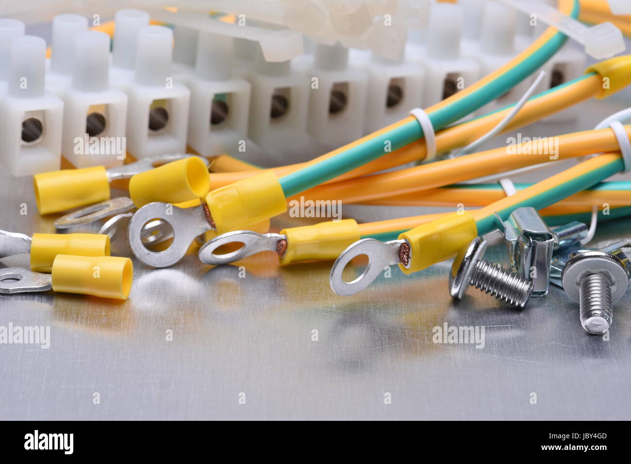 Accessories used in electrical installations on metal gray background ...