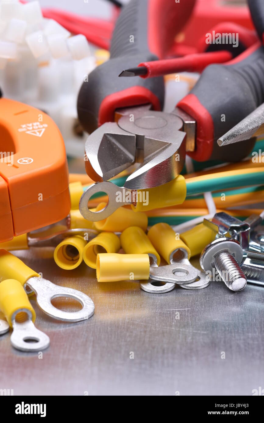 Tools for electrician and cables on metal surface Stock Photo - Alamy