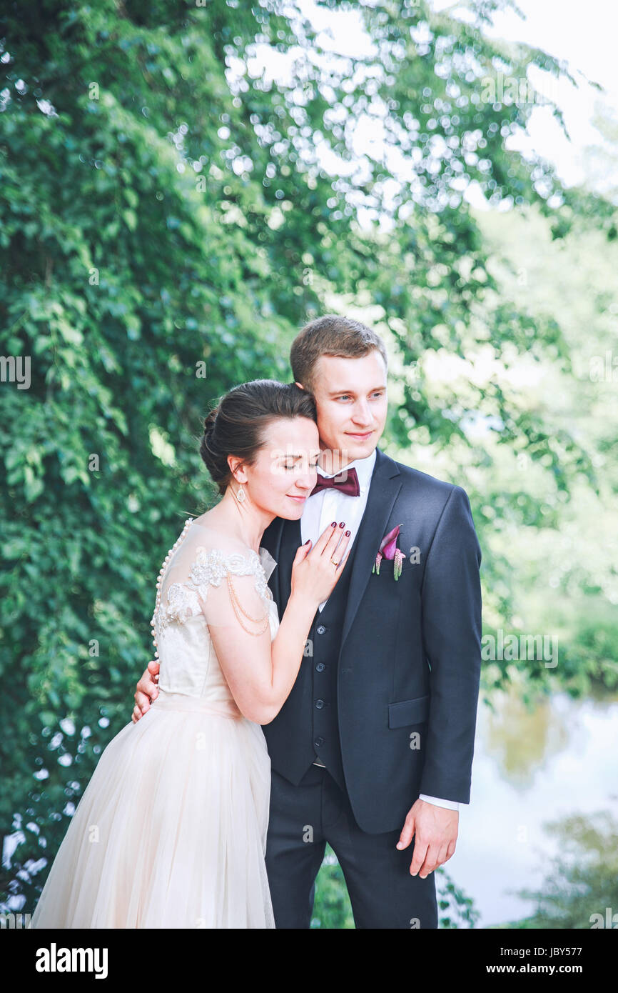 Groom and bride together. Wedding couple. newlyweds bride and groom at ...