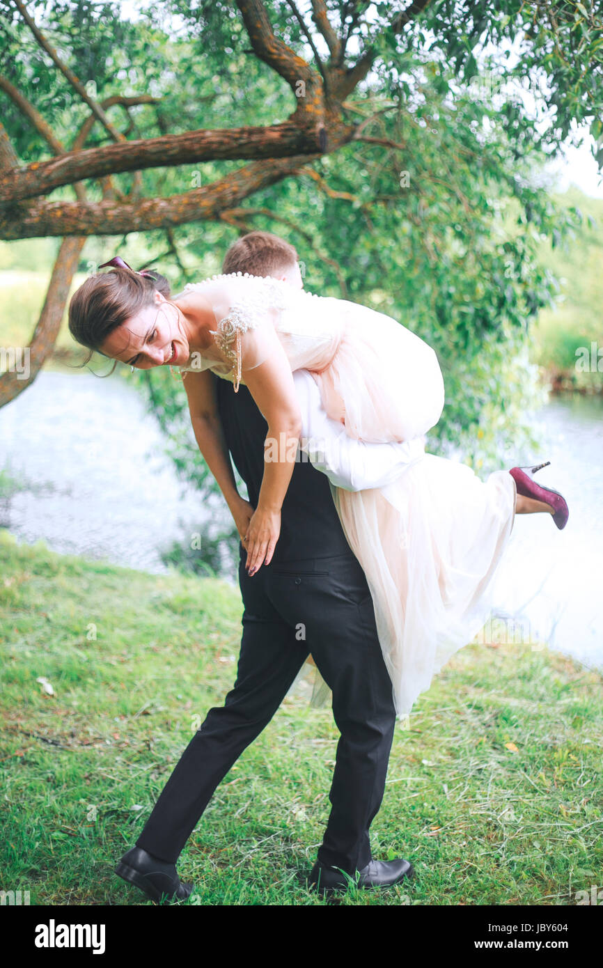 Man carrying wife on back hi-res stock photography and images - Alamy