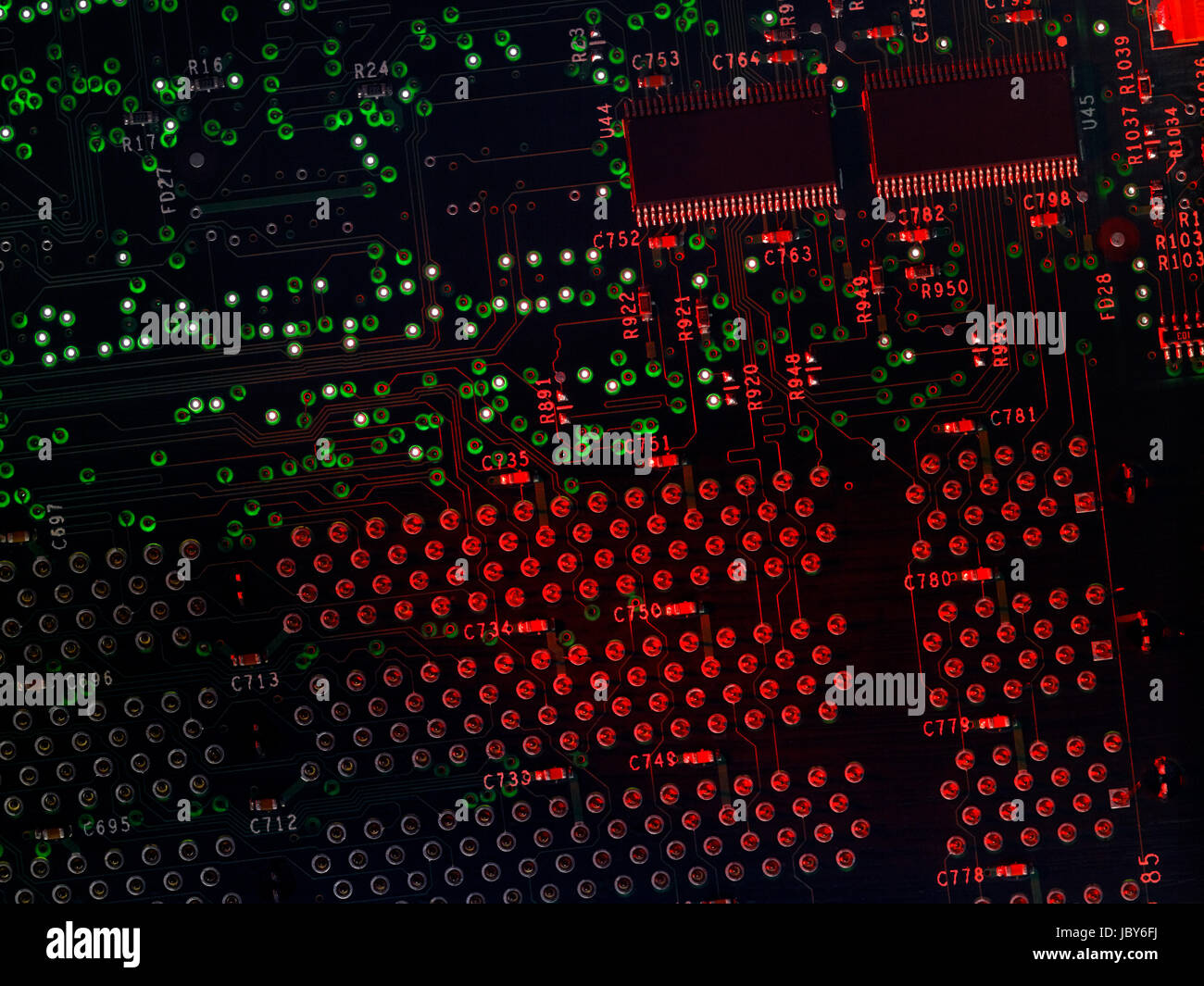 full frame detail of a red illuminated printed circuit board Stock ...