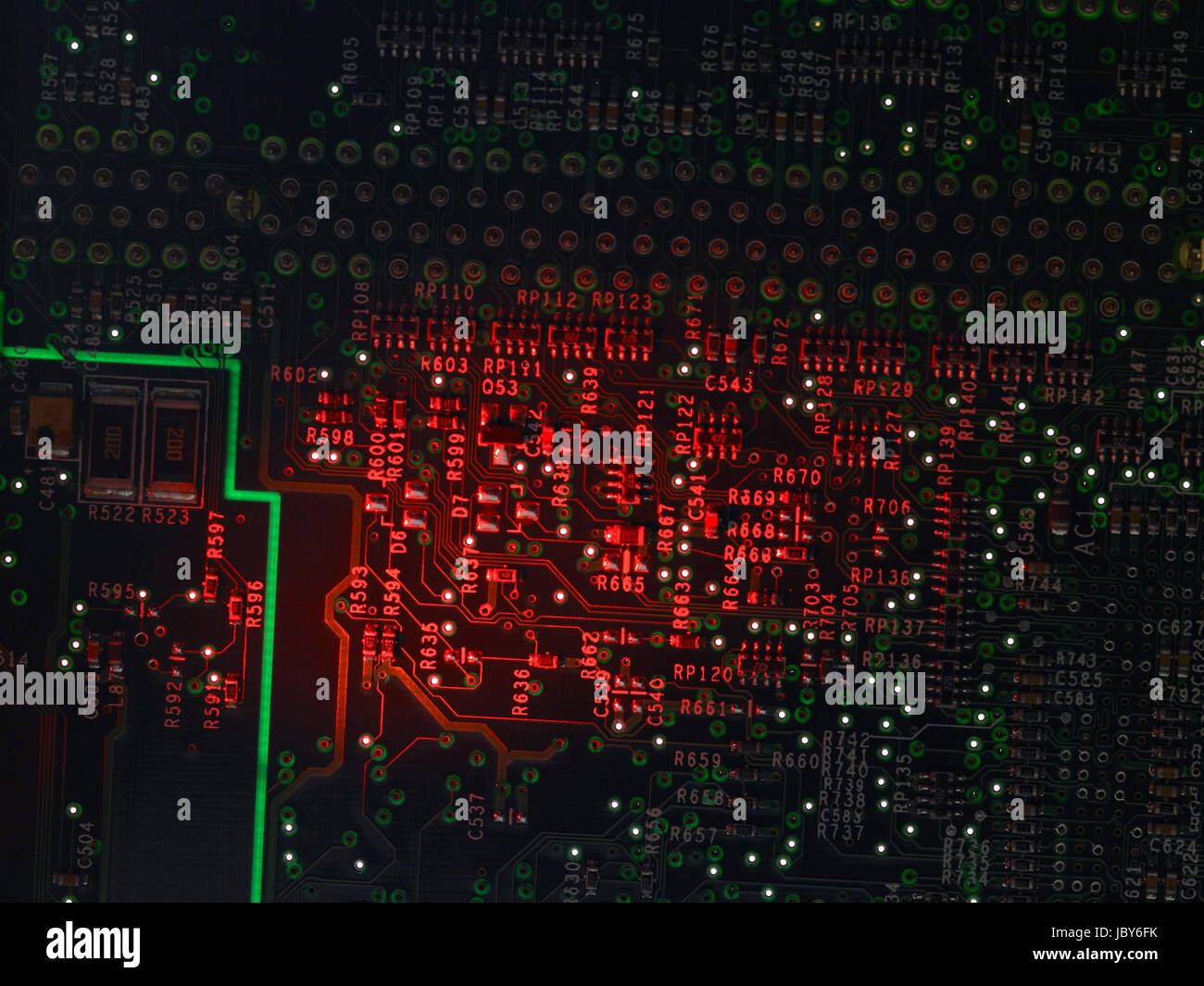 full frame detail of a red illuminated printed circuit board Stock ...