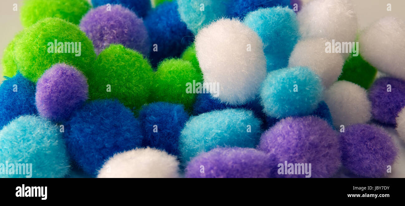 A collection of colorful craft pompoms various colors up close Stock ...