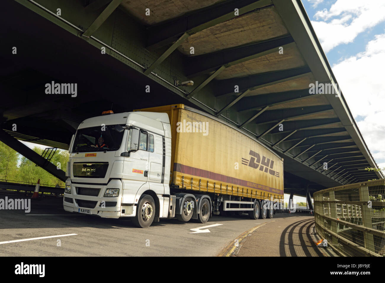MAN truck pulling DHL trailer passes under Tinsley Viaduct, Sheffield ...