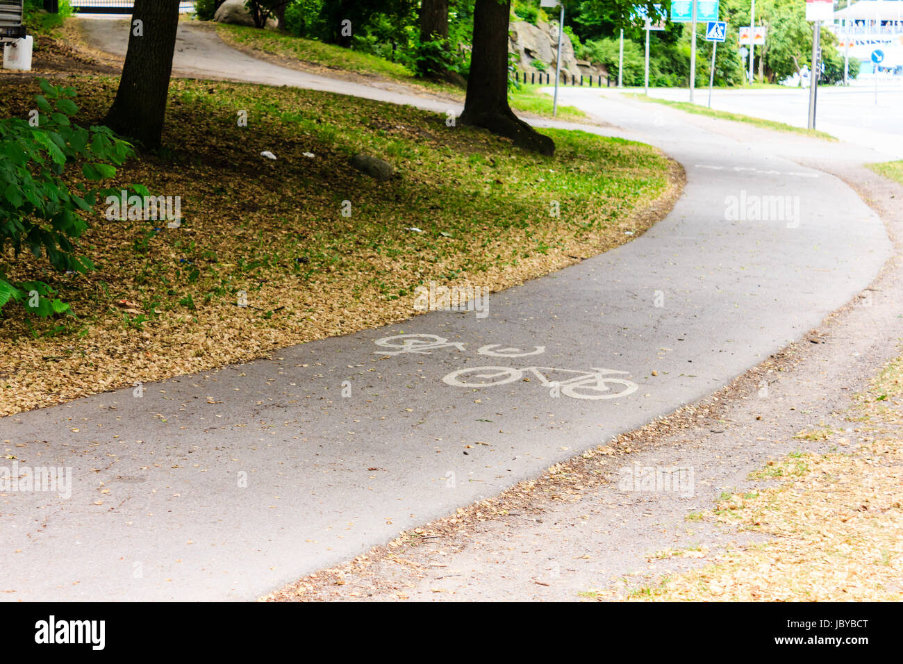 Bicycle road sign painted on the pavement Stock Photo - Alamy
