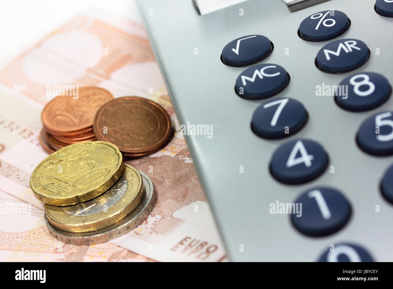calculator and money Stock Photo - Alamy
