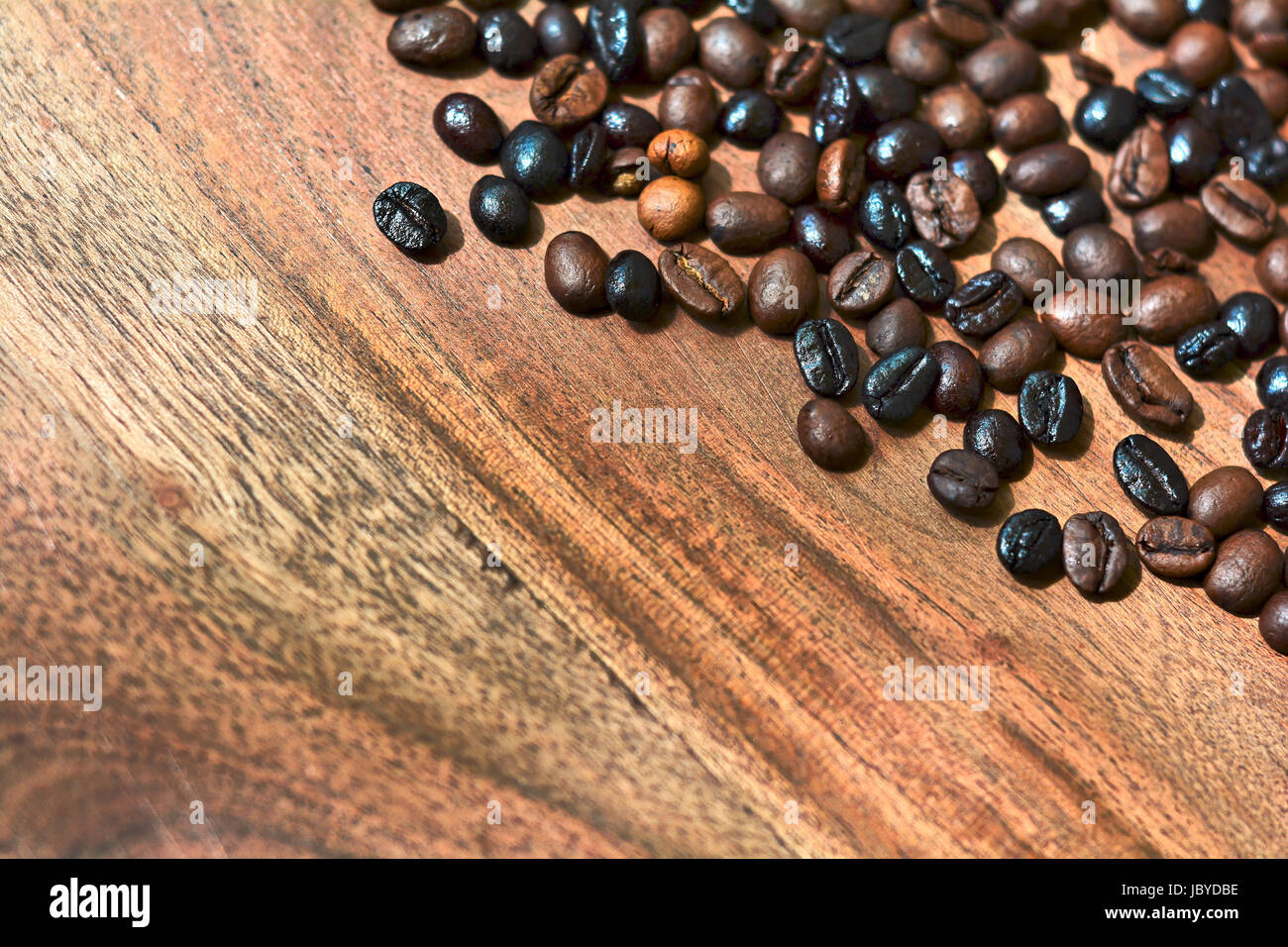 roasted coffee beans on a table Stock Photo - Alamy