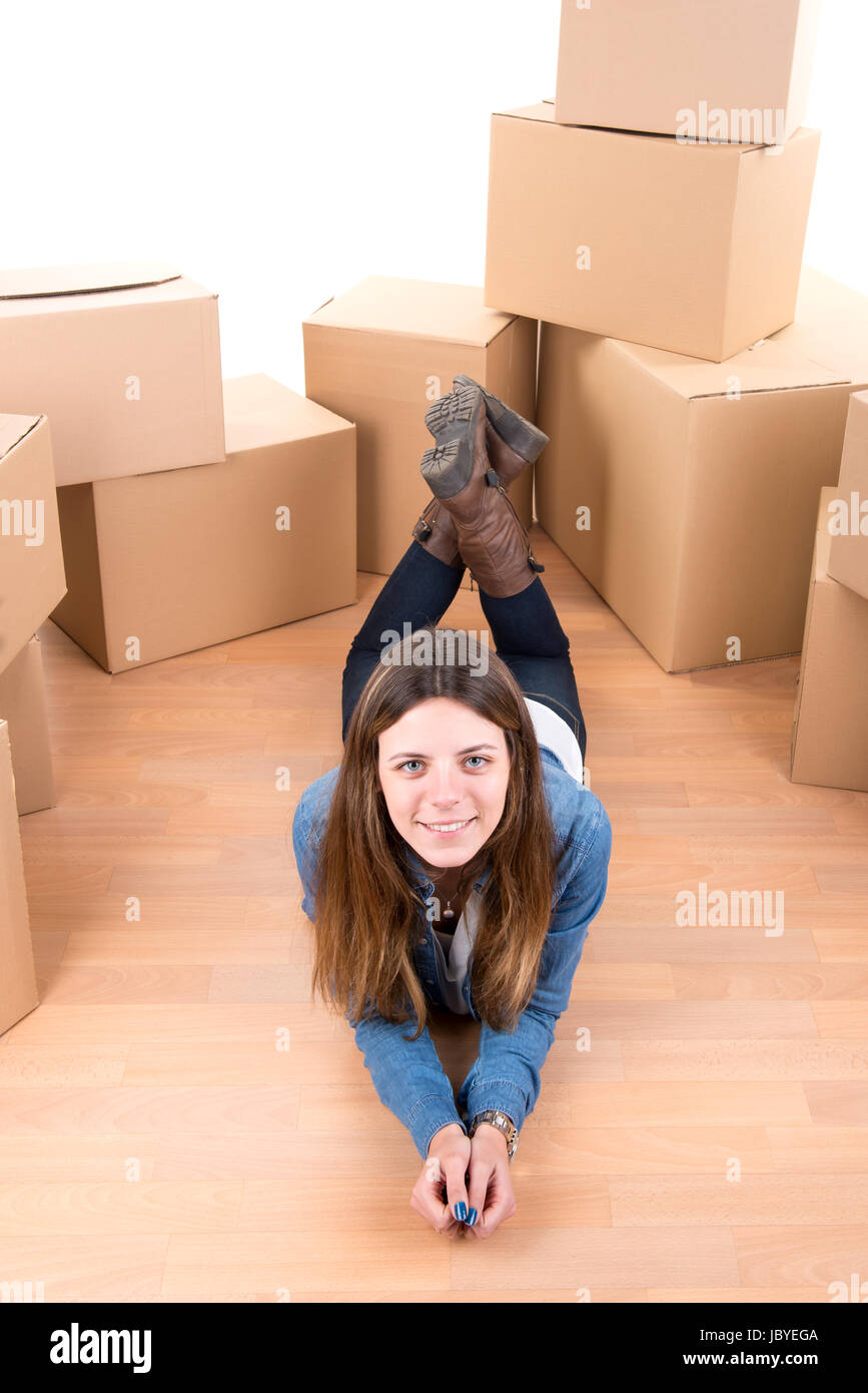 Beautiful girl with cardboard boxes unpacking in new home Stock Photo ...