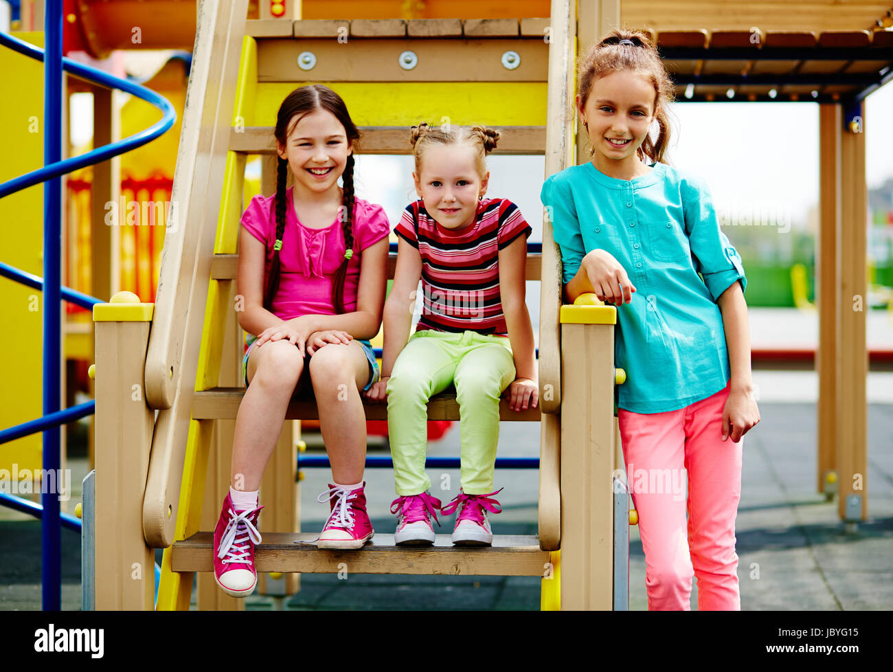 Image of cute girls spending time on playground outdoors Stock Photo ...