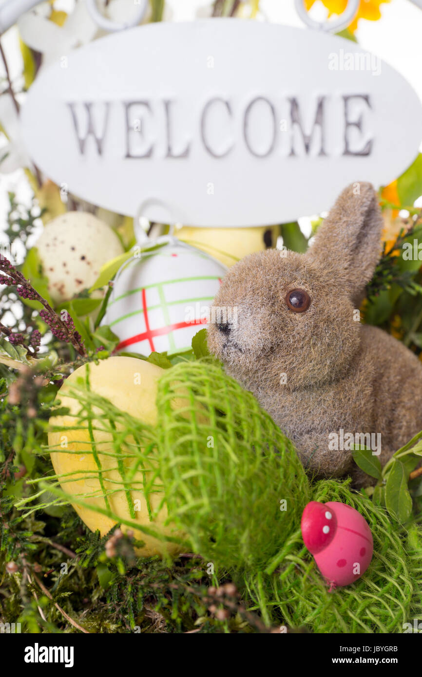 Easter eggs and Easter bunny with welcome sign Stock Photo - Alamy