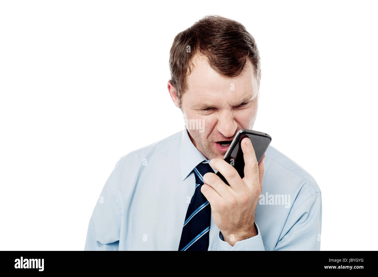 Aggressive man shouting into his cell phone Stock Photo - Alamy
