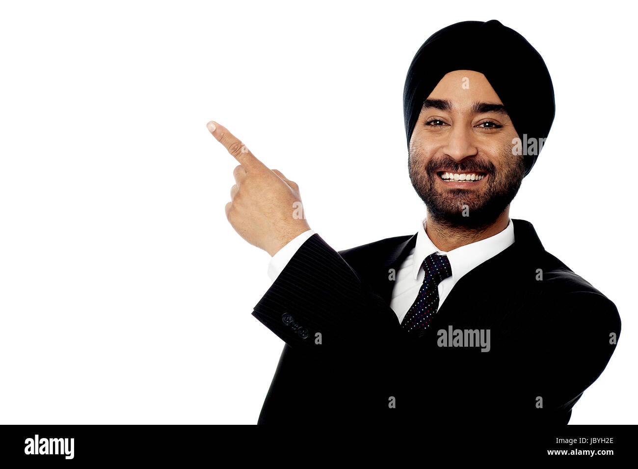 Corporate male executive pointing at something Stock Photo - Alamy