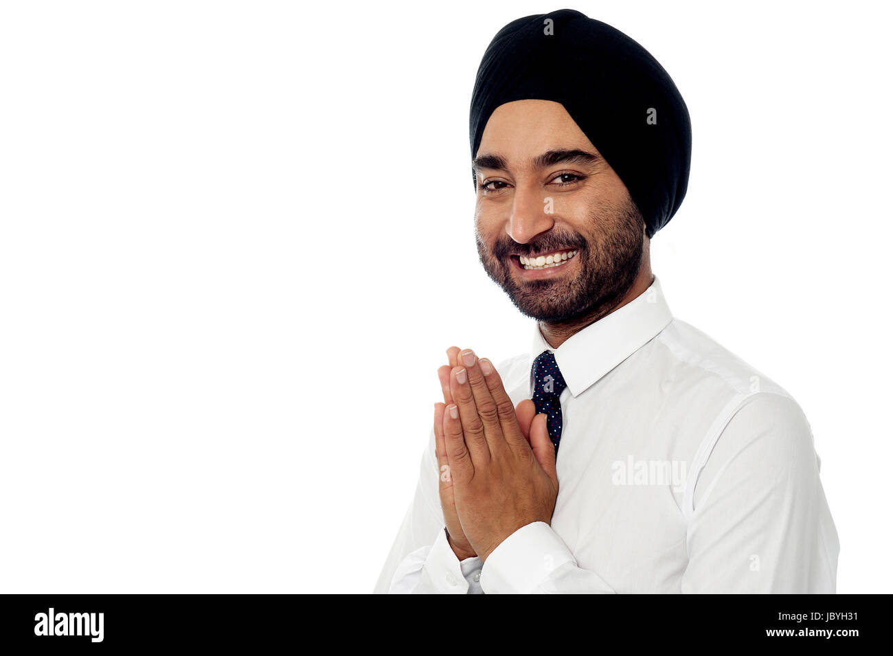 Indian businessman showing welcome gesture Stock Photo - Alamy