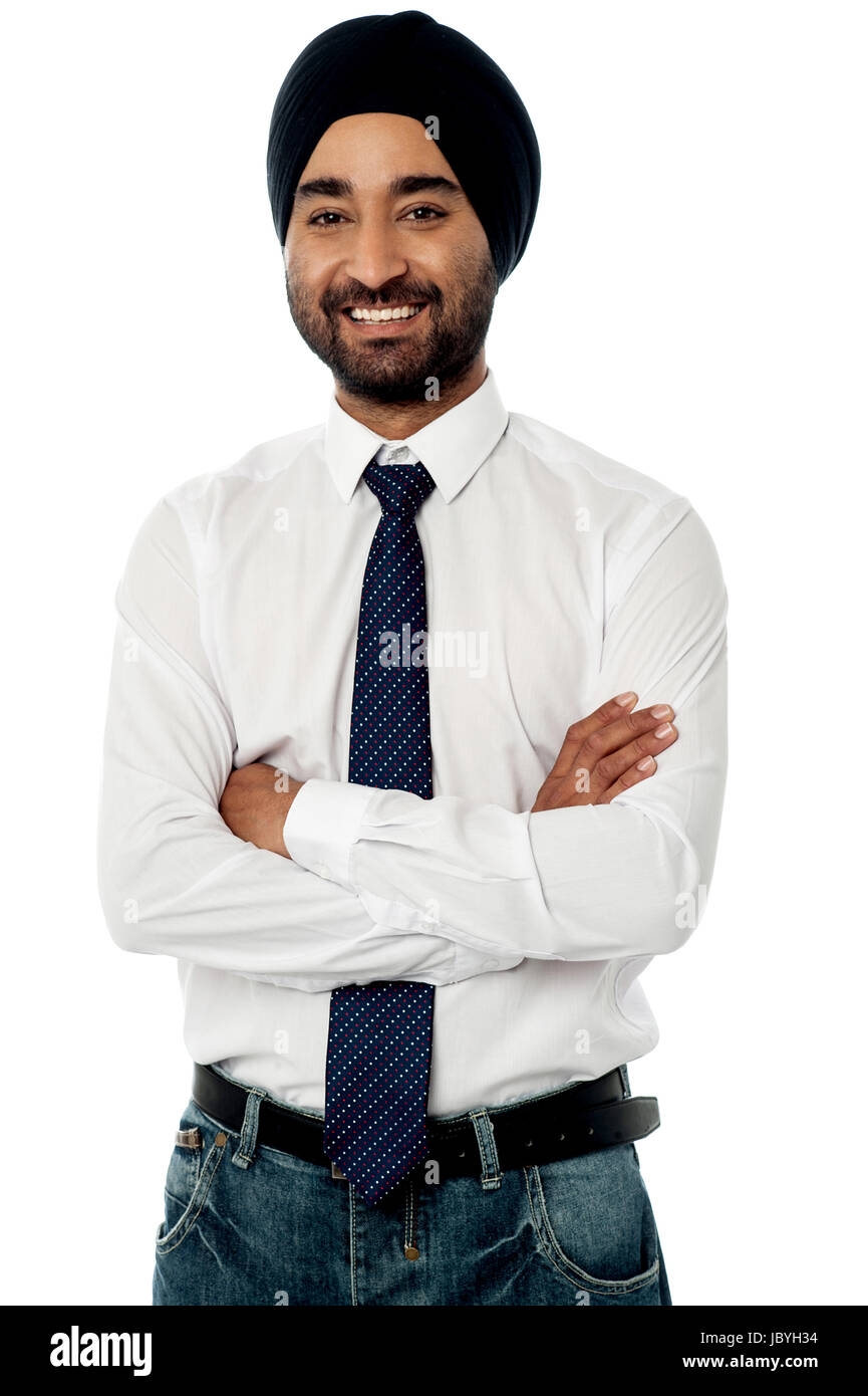 Confident young indian executive with folded arms Stock Photo - Alamy