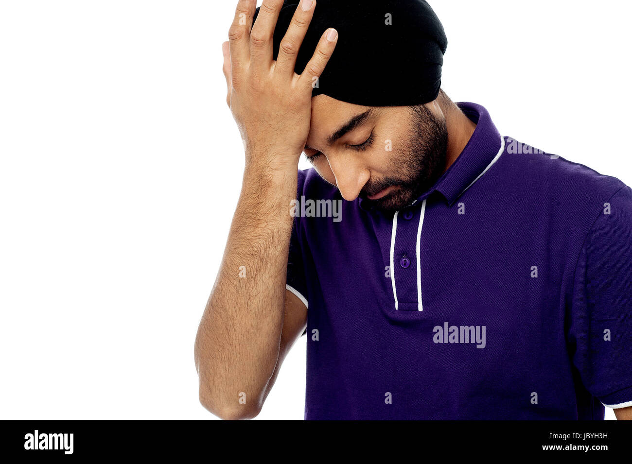 Upset man holding his forehead on hand Stock Photo - Alamy