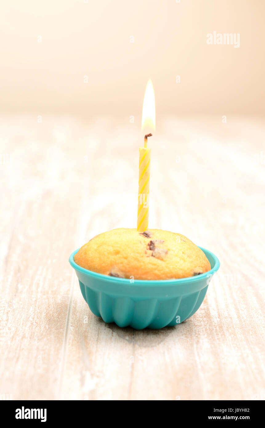 Birthday cake with one candle light Stock Photo - Alamy