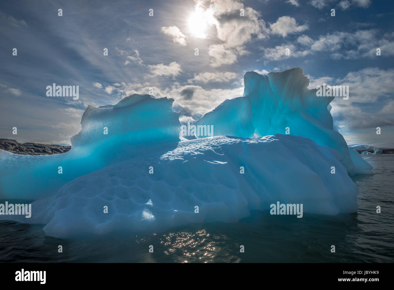 Blue shimmering beautiful iceberg in Antarctica Stock Photo - Alamy