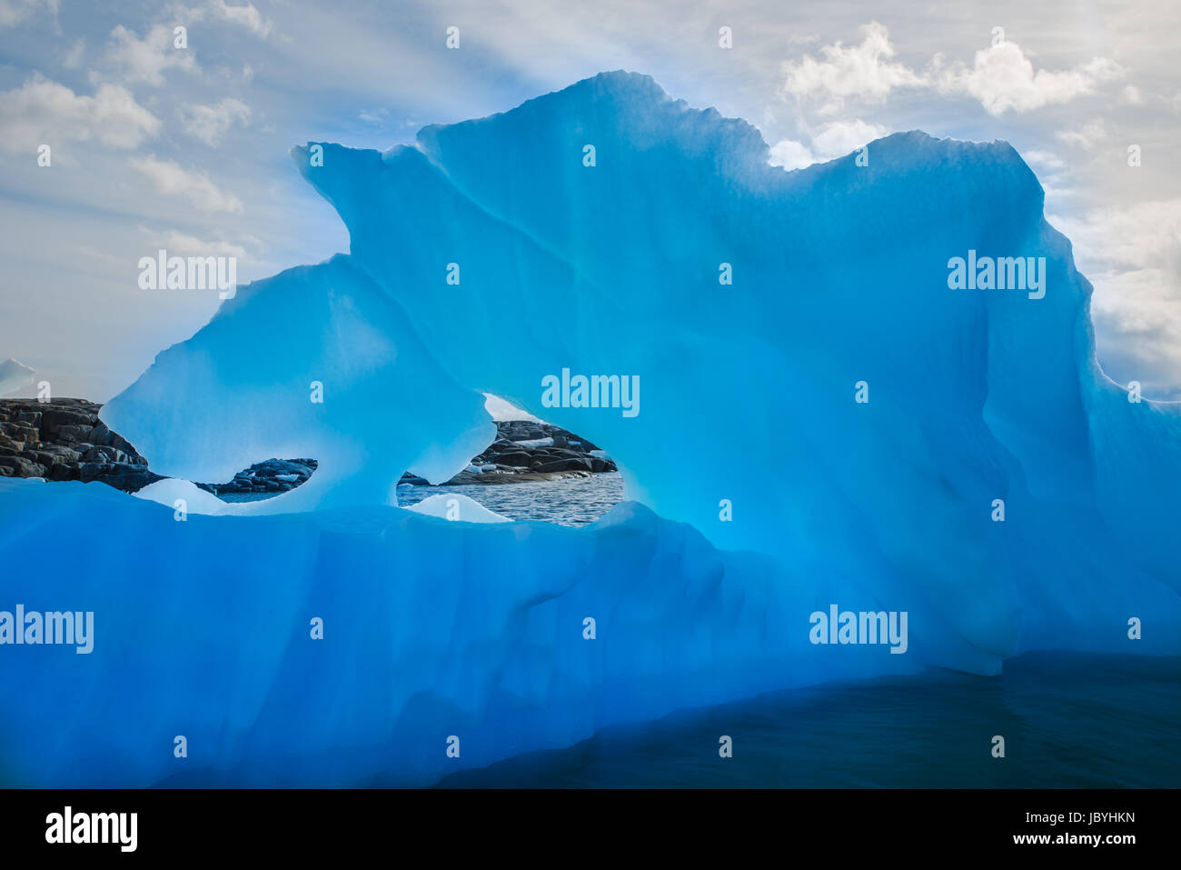 Blue shimmering beautiful iceberg in Antarctica Stock Photo - Alamy