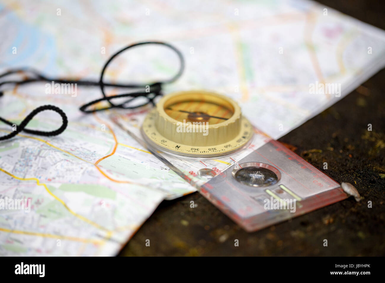 old touristic handheld compass on detailed territory map Stock Photo ...