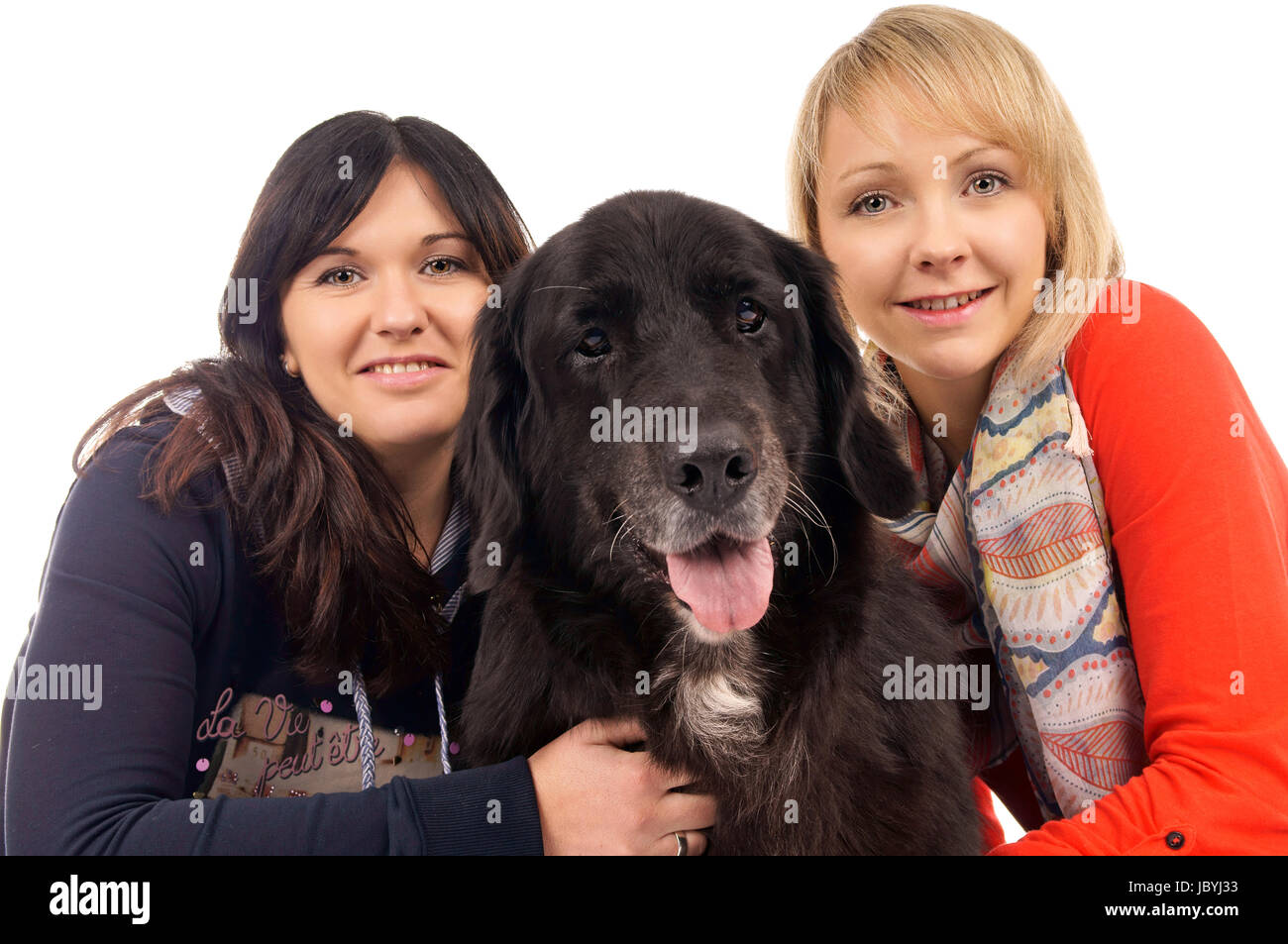Two young woman with dog Stock Photo - Alamy