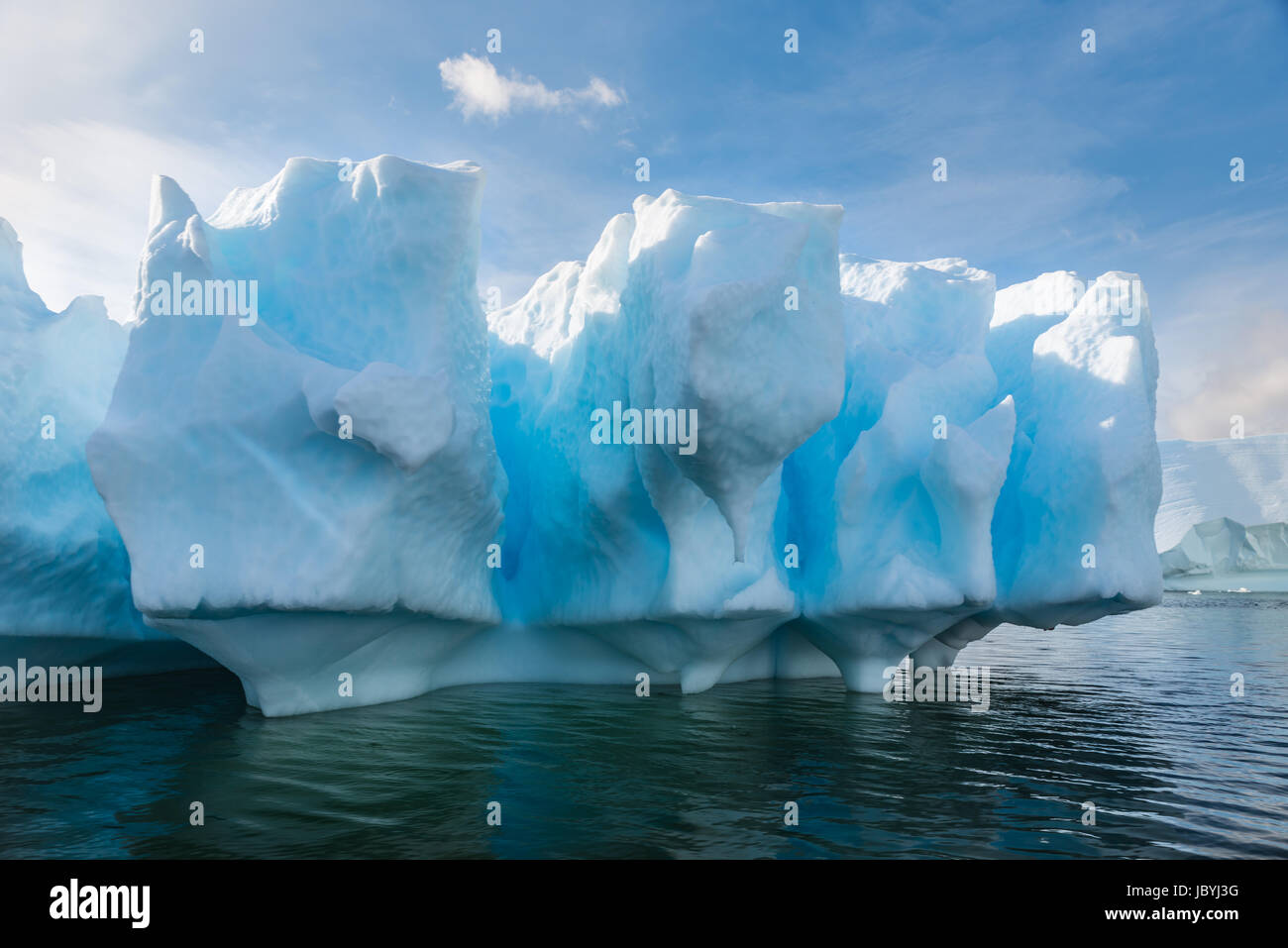 Blue shimmering beautiful iceberg in Antarctica Stock Photo - Alamy