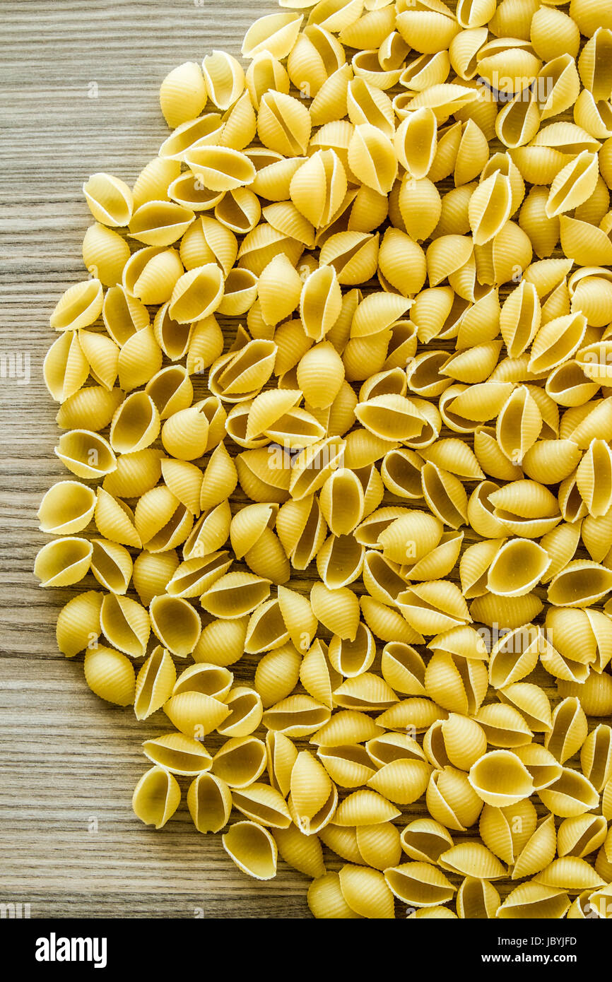 Italian dry pasta covers all over the wooden table Stock Photo - Alamy