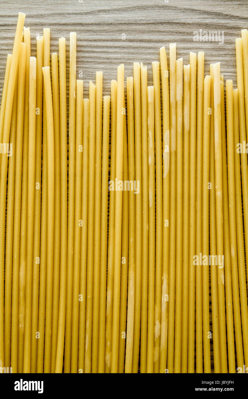 Italian dry pasta covers all over the wooden table Stock Photo - Alamy