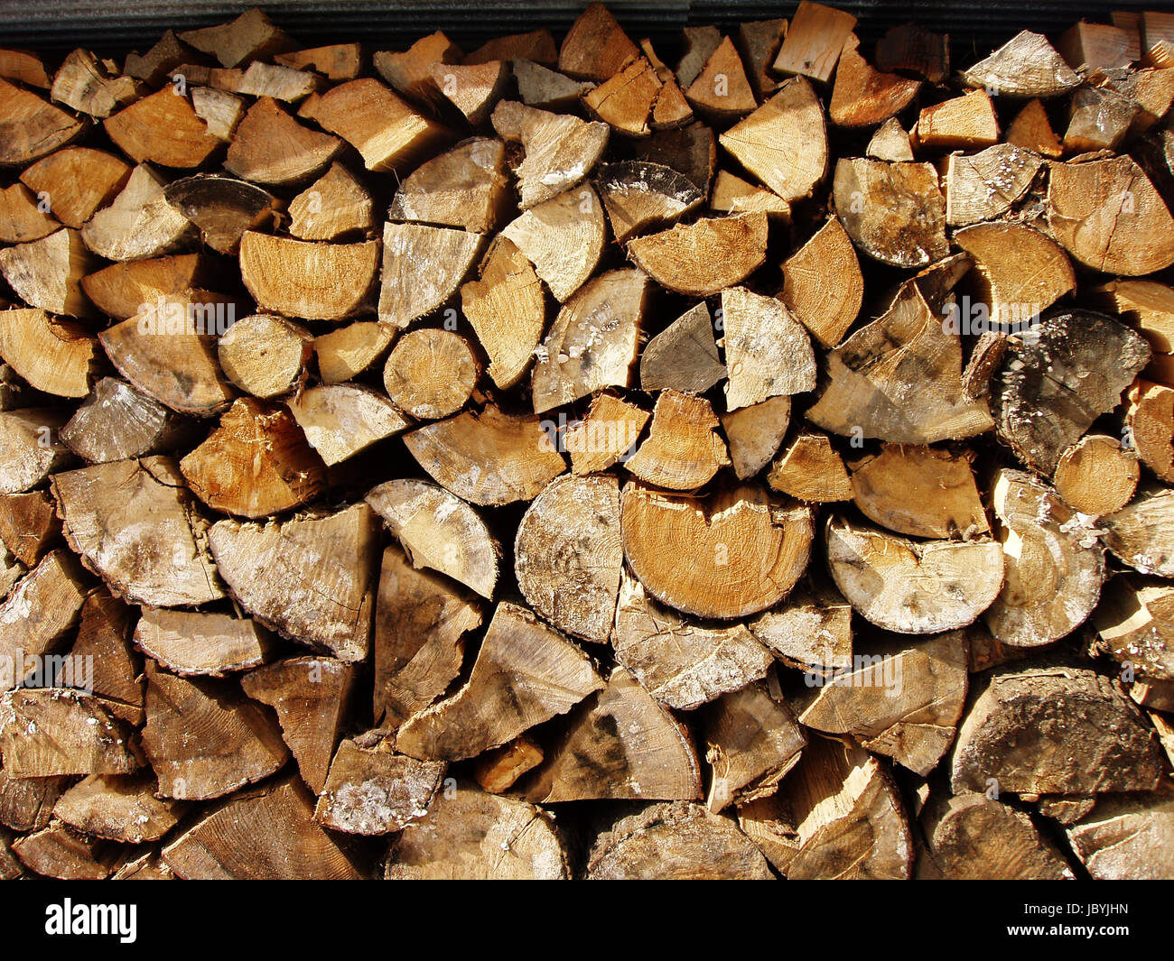 Stack of wood in backyard of a house Stock Photo - Alamy