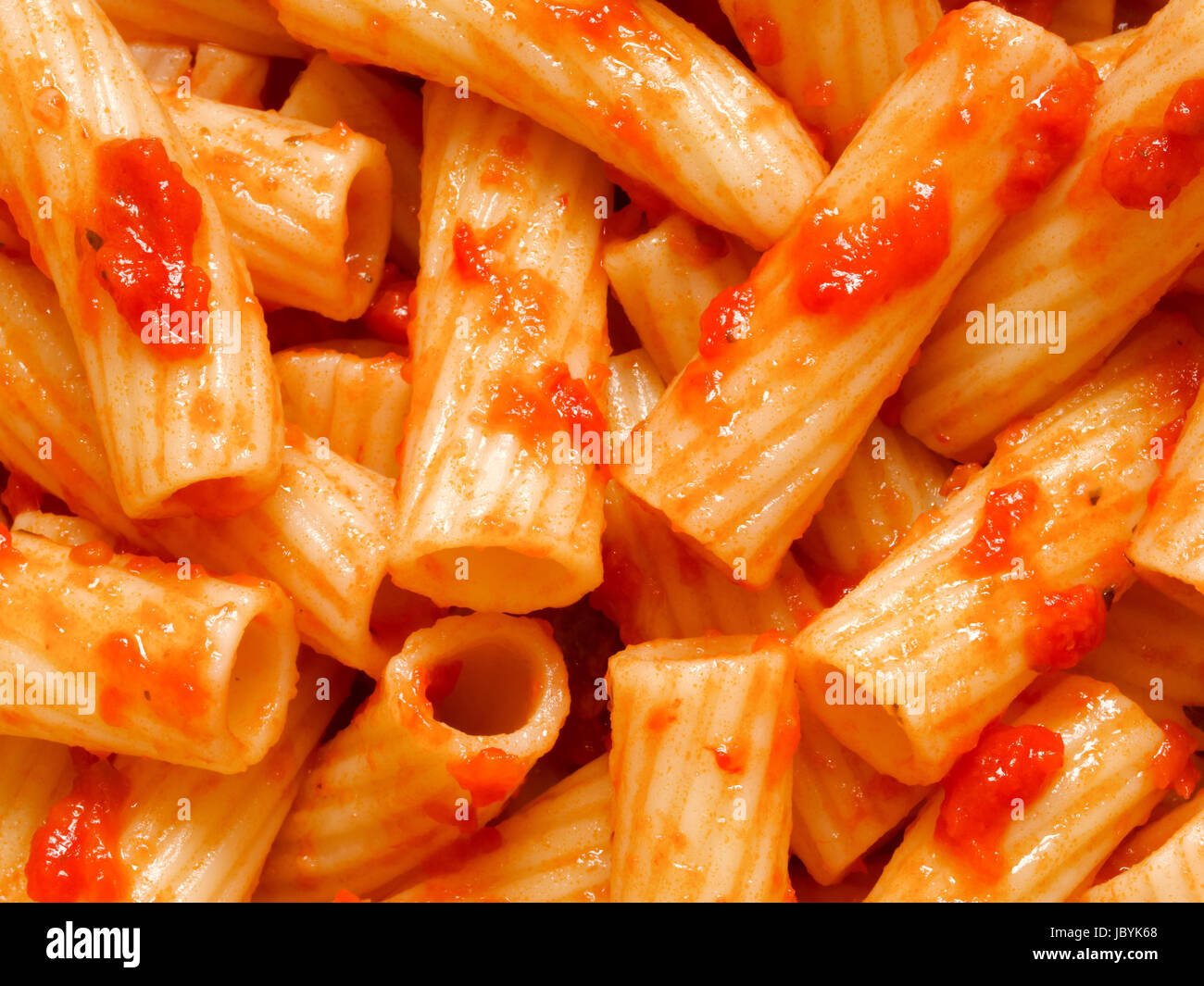 close up of maccheroni pasta in tomato sauce food background Stock ...