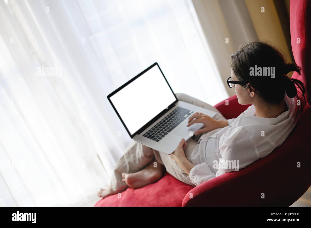 woman working on laptop computer and relax at modern home Stock Photo ...