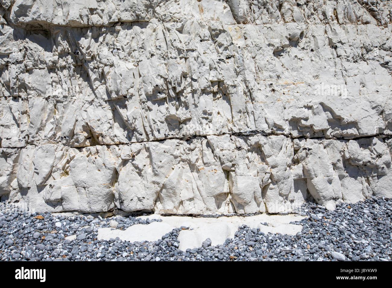 A close-up of the layers of Chalk in the white cliffs along the ...
